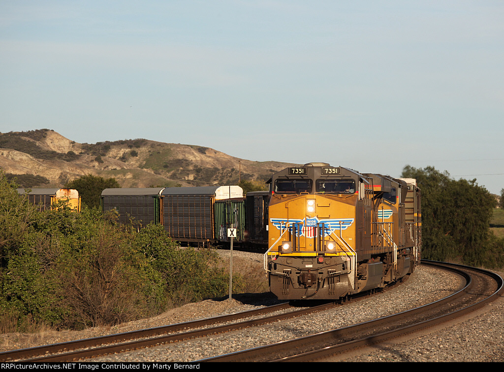 UP 7351 Rolls Down the Hill With Mixed Freight